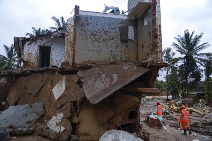 Rescuers search through mud and debris as deaths rise to 166 in ...