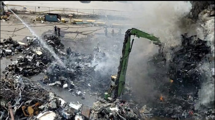 Orange County crews battle large scrap-metal fire