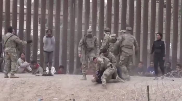 Migrants storm border in El Paso, Texas, overwhelming National Guard