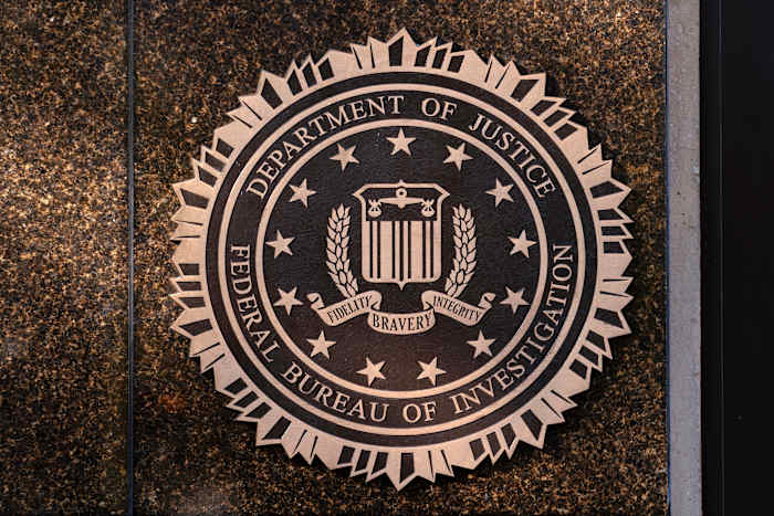 Veteran FBI employee sues bureau after being fired over displaying a ...