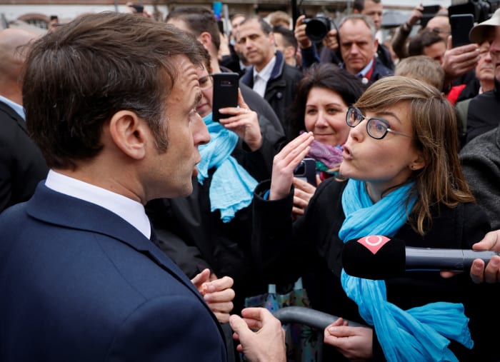 France's Macron heckled by crowd angry over pensions