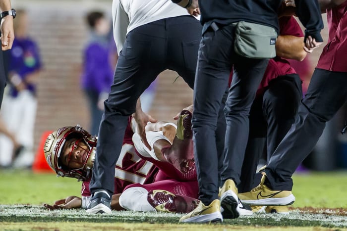 Florida State QB Jordan Travis carted off after injury to left leg ...