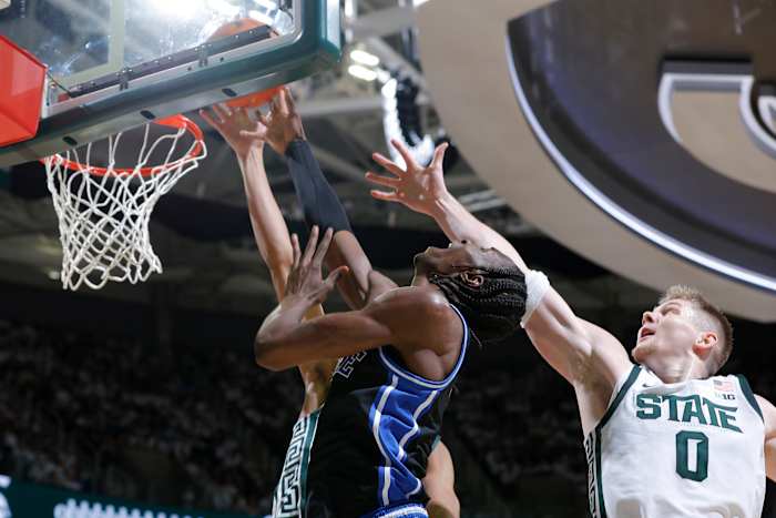 Cameron Boozer scores 18 in No. 4 Duke's 66-60 win over No. 7 Michigan ...