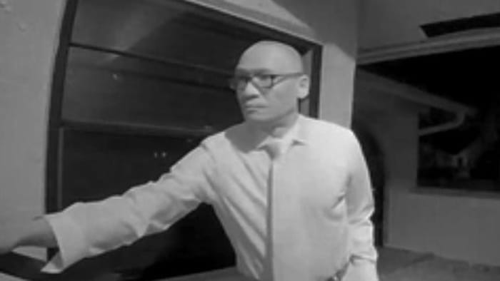 Surveillance Video Shows Machete Wielding Man Knocking On Doors In