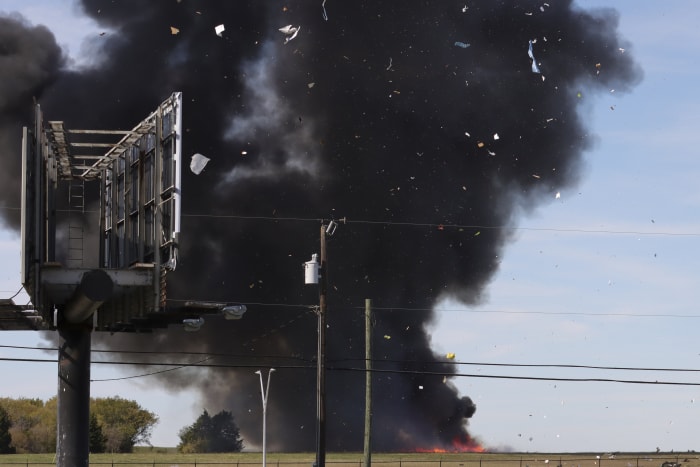 Videos, photos show aftermath of military plane crash at air show in Dallas