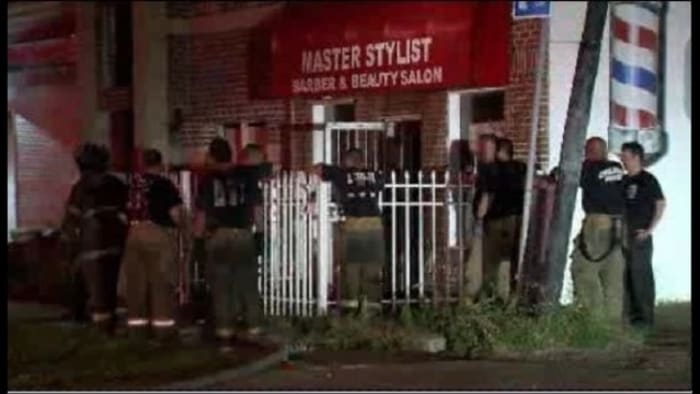 Detroit firefighters escape collapsing roof while battling barber shop fire