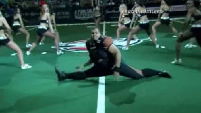 Fake football player joins dance squad for routine