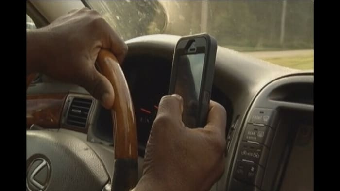 Texting while driving ban hard to enforce