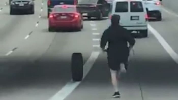 Man caught on video chasing tire through busy Houston highway