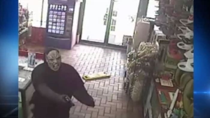 Police search for food store robber caught on camera