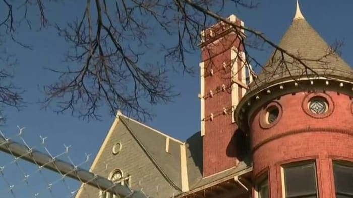 Crews slowly move 124-year-old David Mackenzie House in Detroit's Midtown