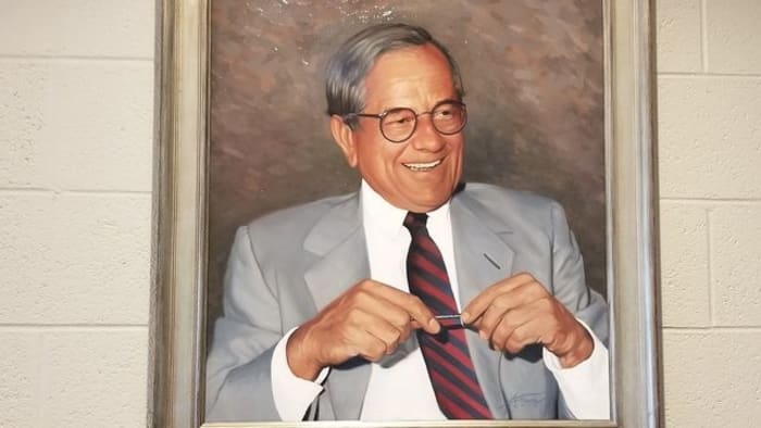Portrait of John Fishwick hangs on wall in middle school named in his honor