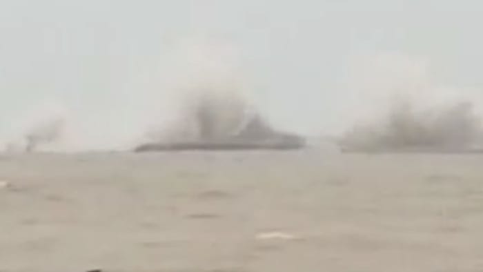 VIDEO: High winds, waves knock lighthouse into Lake Michigan