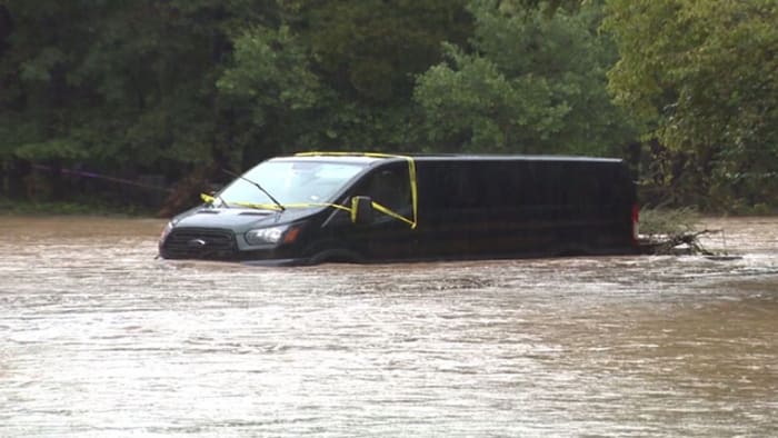 Special-needs adults rescued from van stuck in flooded stream