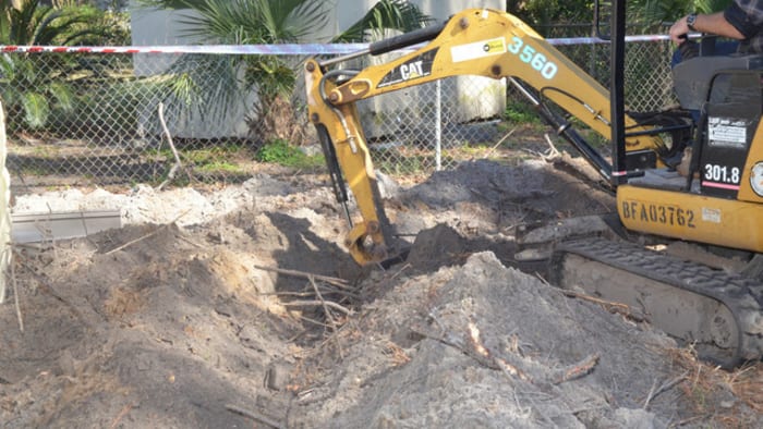 Evidence photos give glimpse inside home where woman found buried
