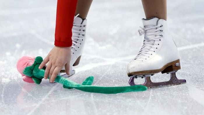Who cleans up the stuffed animals and flowers after a figure skater ...