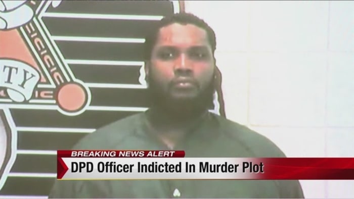 Detroit police officer indicted in murder plot