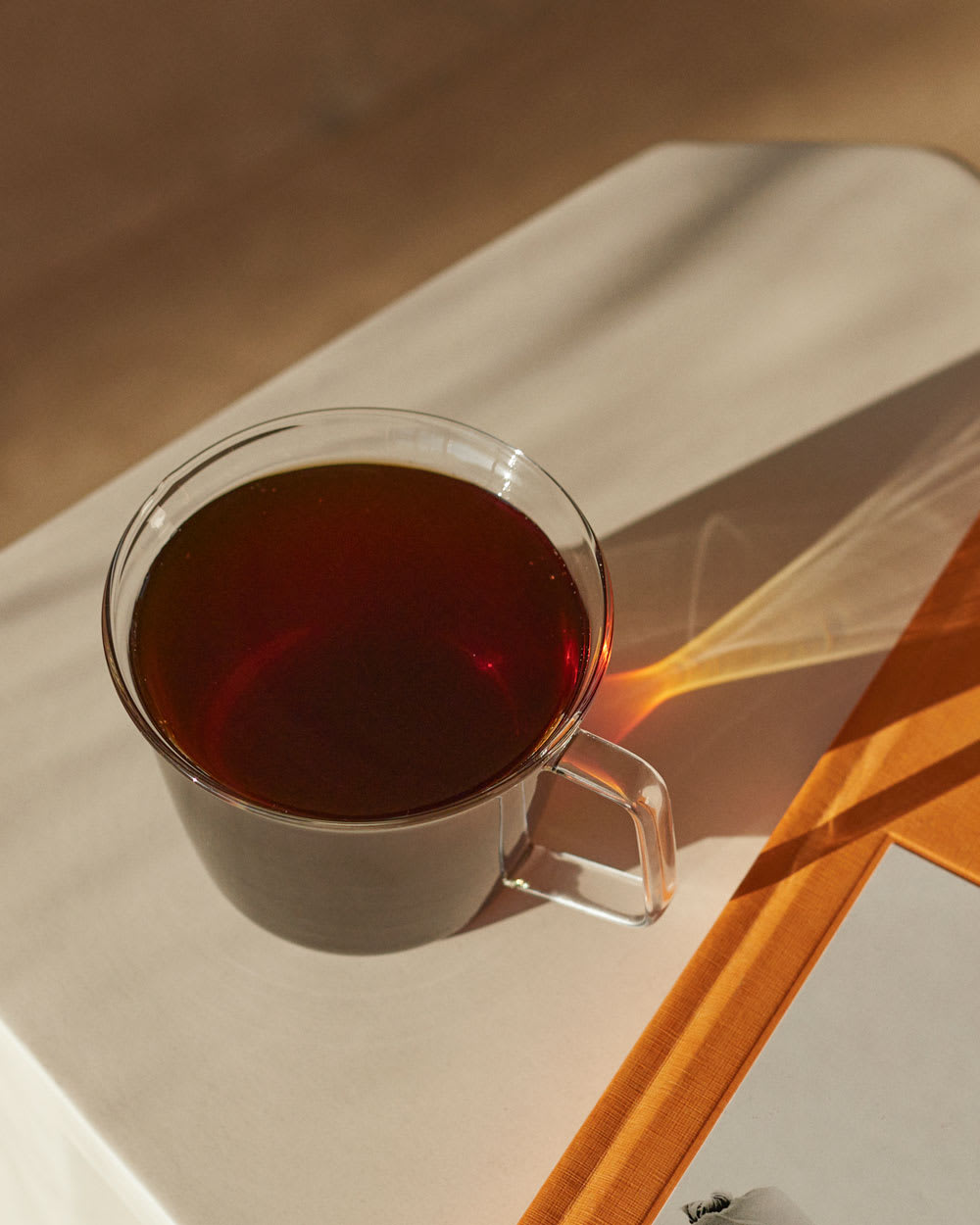 Single Origin Coffee in a glass mug on white table