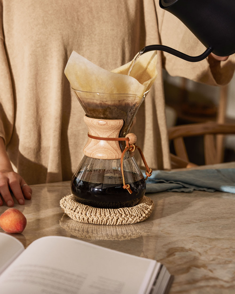 Chemex on table with coffee brewing