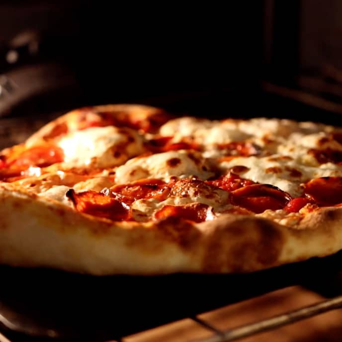 how to cook a pizza on a pizza stone in the oven