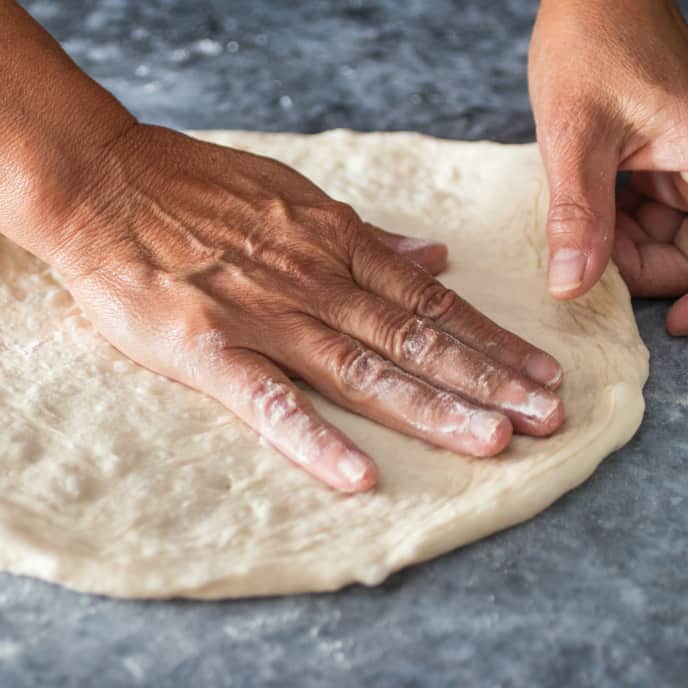 Pro Tips for Stretching Pizza Dough | America's Test Kitchen