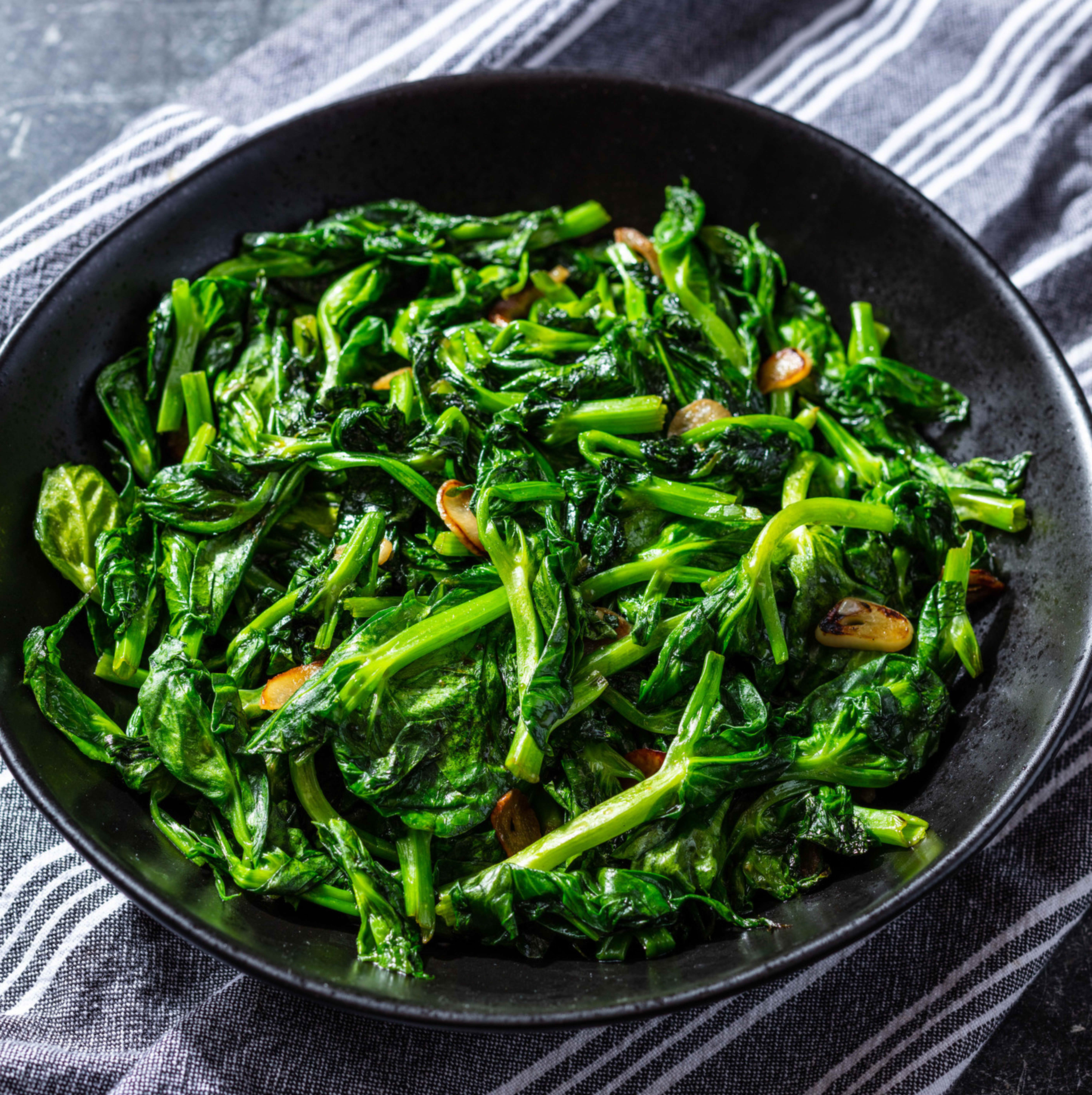 Stir-Fried Pea Greens with Oyster Sauce and Garlic | America's Test Kitchen