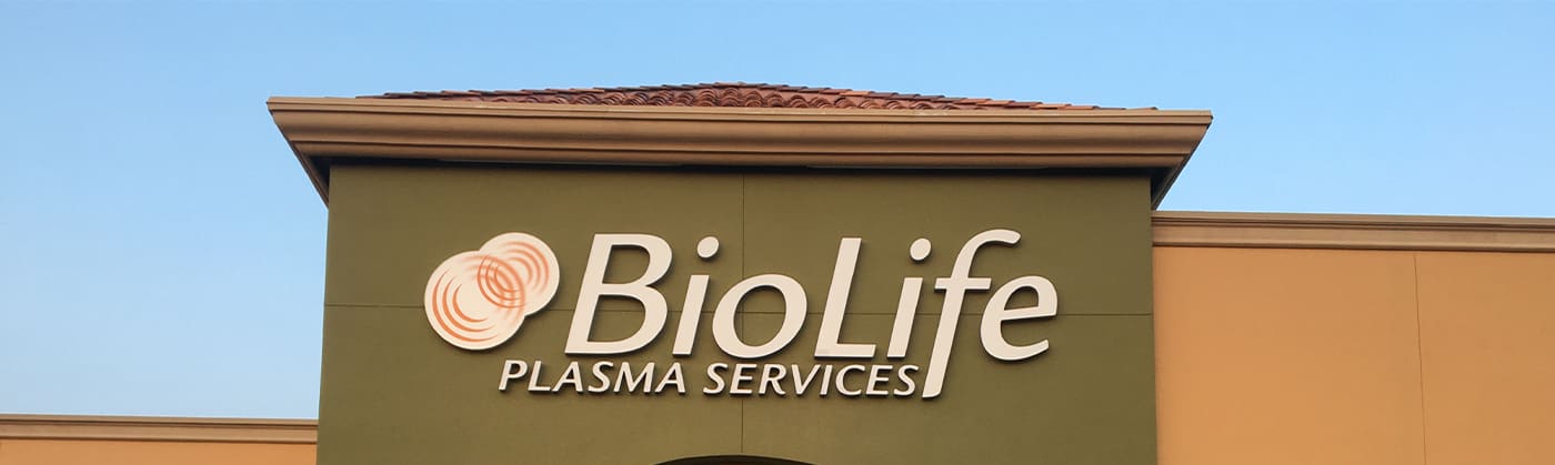Green front entrance sign of BioLife Plasma Services plasma donation ...