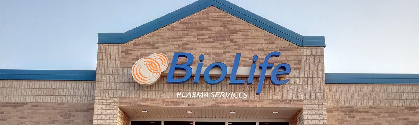 Vibrant front entrance sign of BioLife Plasma Services plasma donation ...