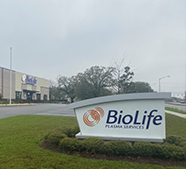 BioLife Plasma Services sign with plasma donation center in background ...
