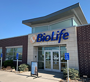 American flag waving next to front entrance of BioLife Plasma Services ...