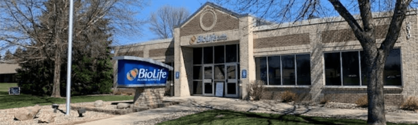Grass lawn and American flag at entrance of BioLife Plasma Services ...