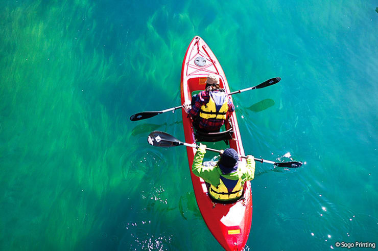 Explore a cave in a famous blue ocean onboard a clear kayak