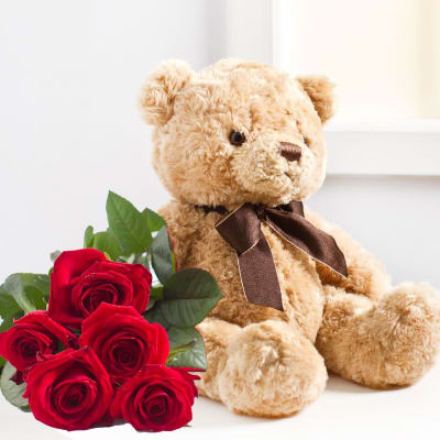 7 roses and teddy bear | Interflora