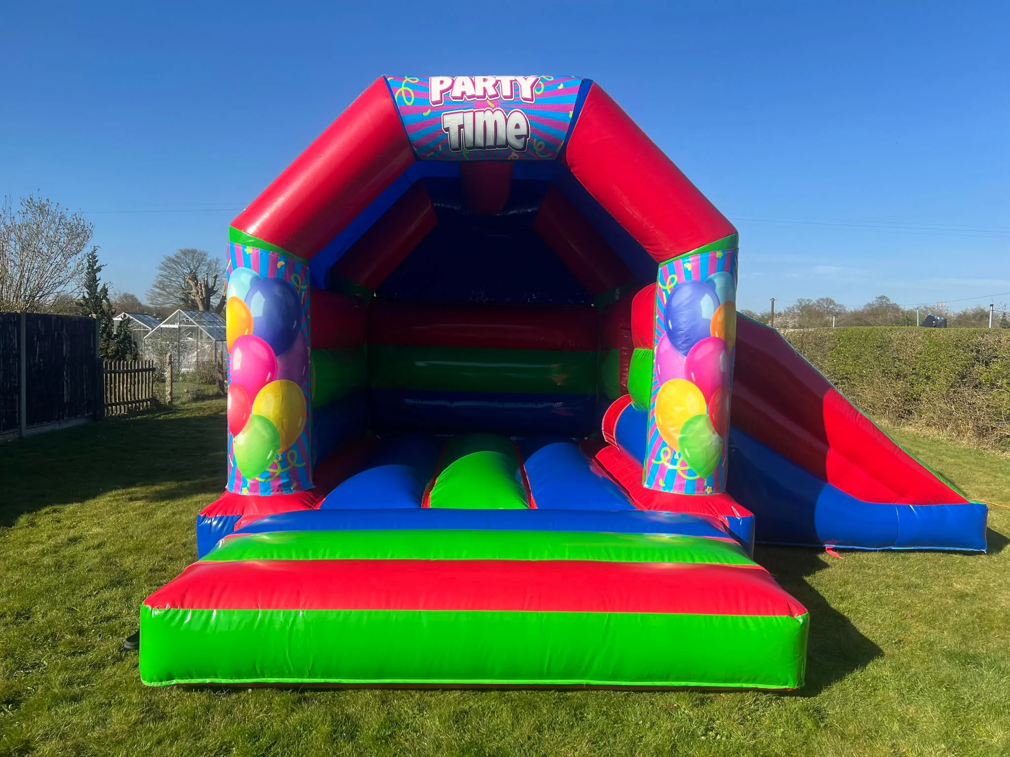 Party Time Themed Green And Red Castle With Side Slide - Inflata-fun ...