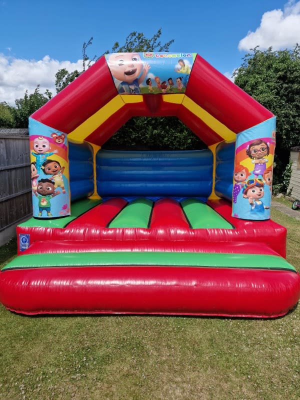 Cocomelon Multicoloured Castle - Bounce With Us Inflatable Hire