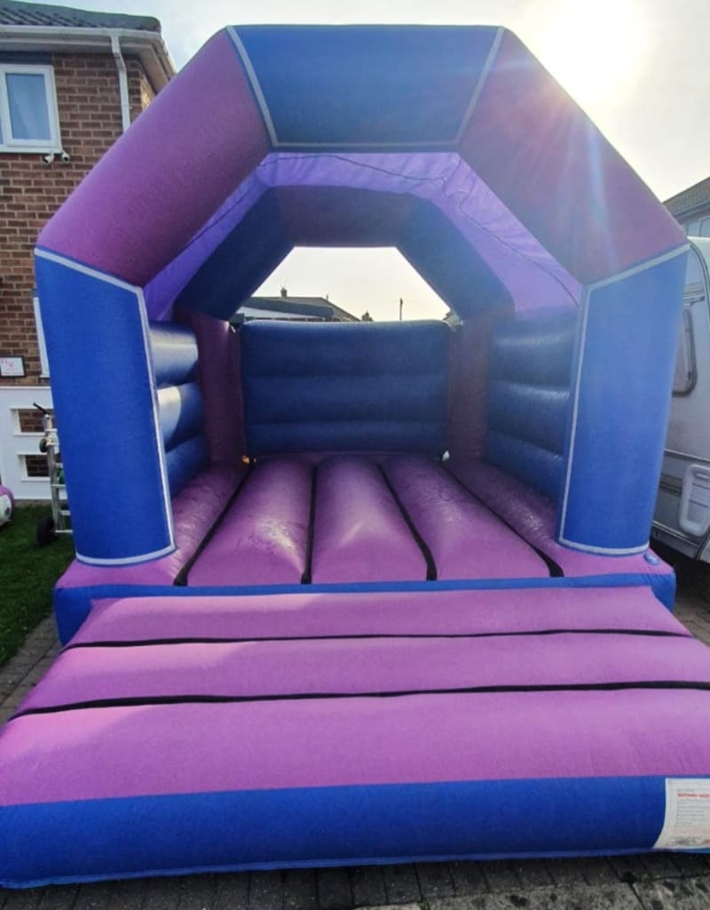 Purple And Blue Bouncy Castle Inflatable and Soft Play Hire Redcar