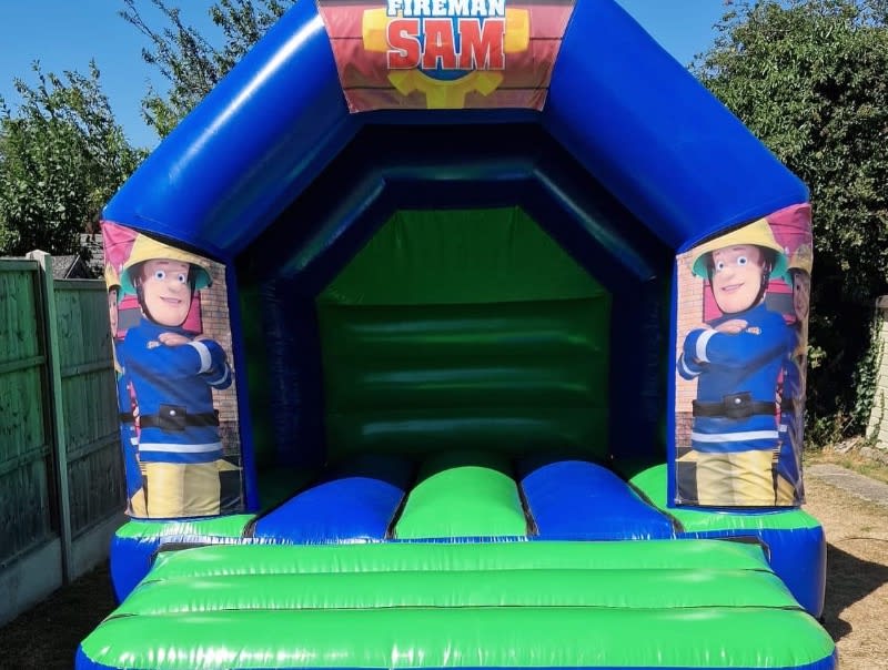 Fireman Sam Blue And Green Castle - Bounce With Us Inflatable Hire