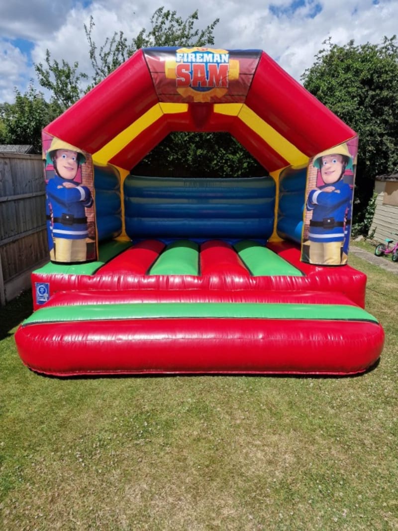 Fireman Sam Multicoloured Castle - Bounce With Us Inflatable Hire