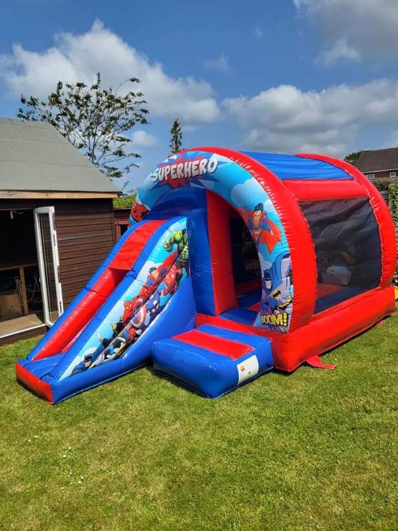 Superhero Circle Bouncy Castle With Front Slide - Funday Kent