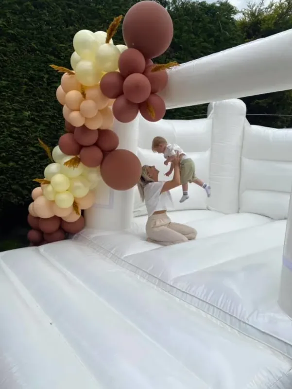 White Bouncy Castle With Balloon Garland - Sj Leisure Dress Your Event ...