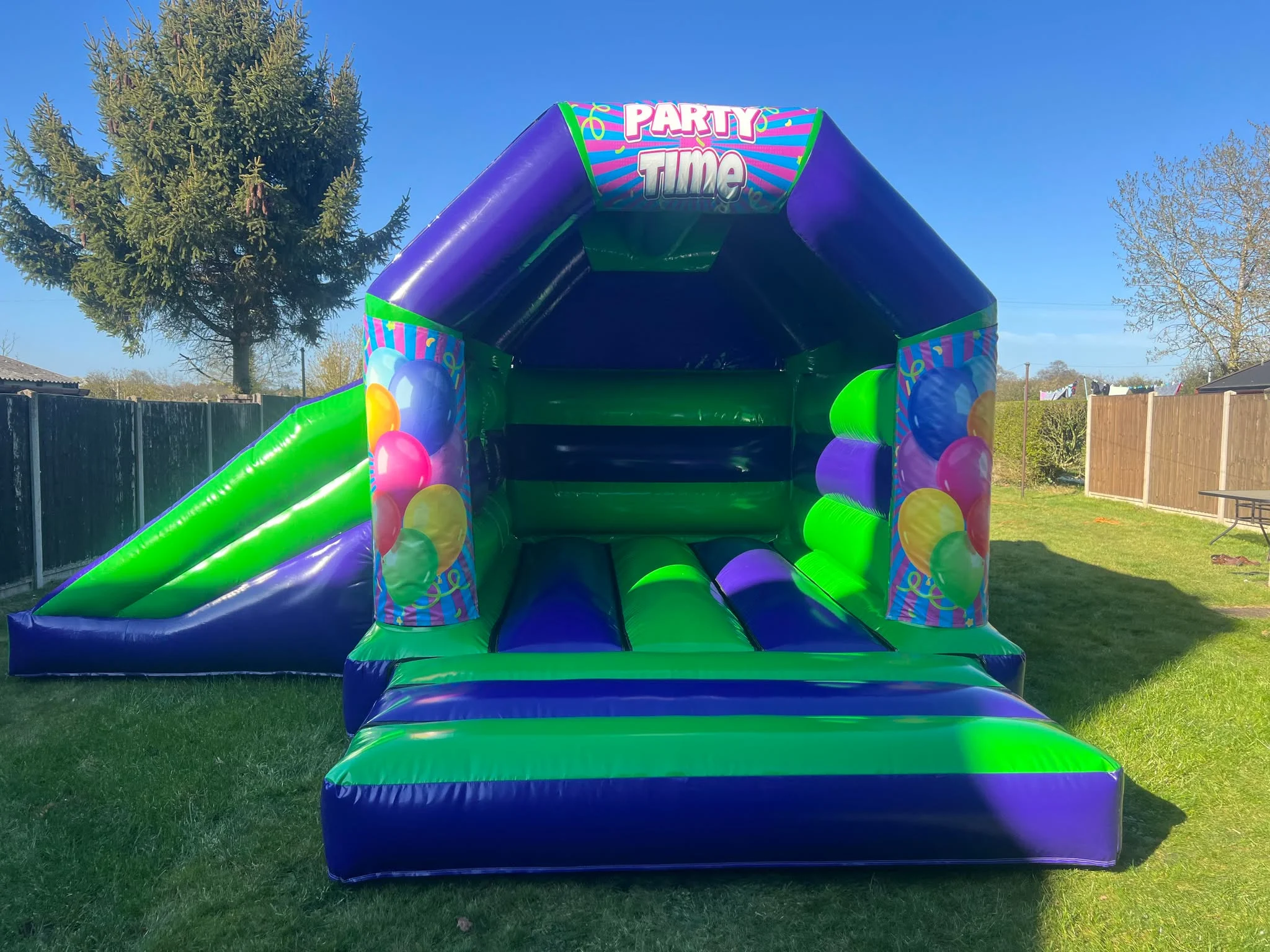 Party Time Themed Green And Purple Castle With Side Slide - Inflata-fun ...