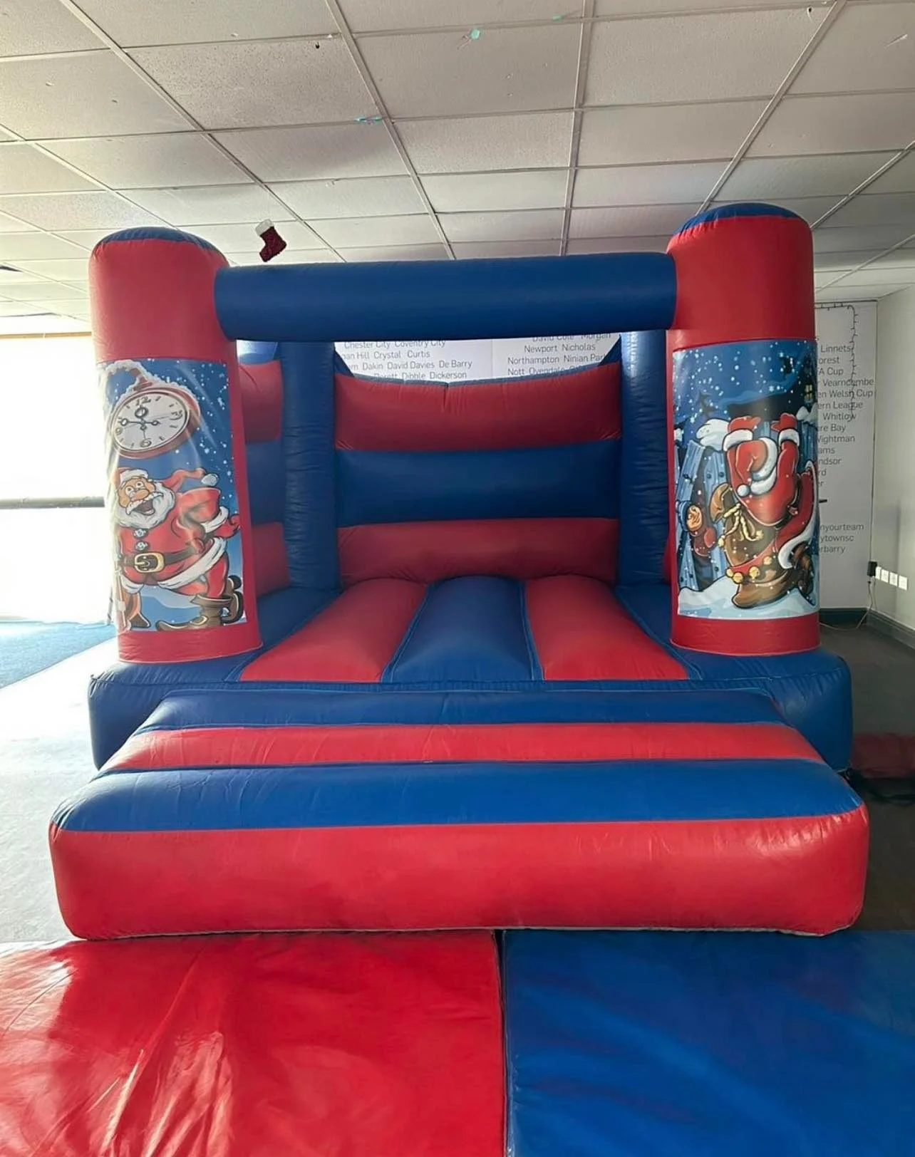 Red And Blue Small Castle Santa Bouncy Bees Bouncy Castle Hire