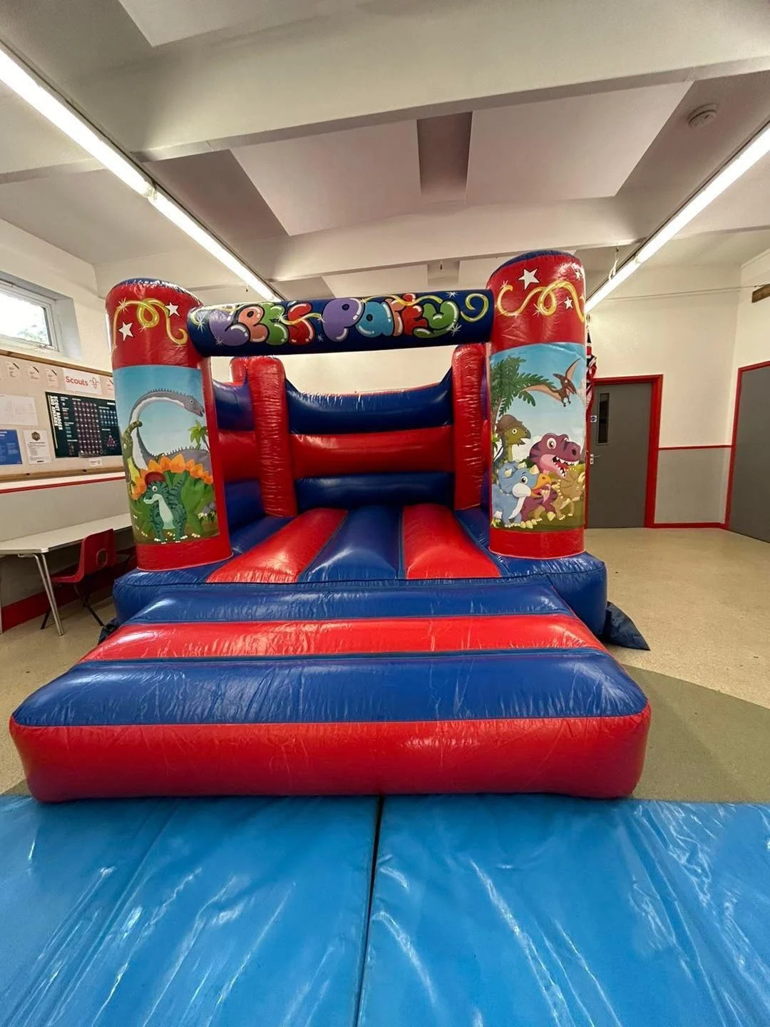 Red And Blue Small Castle Dinosaur Bouncy Bees Bouncy Castle Hire