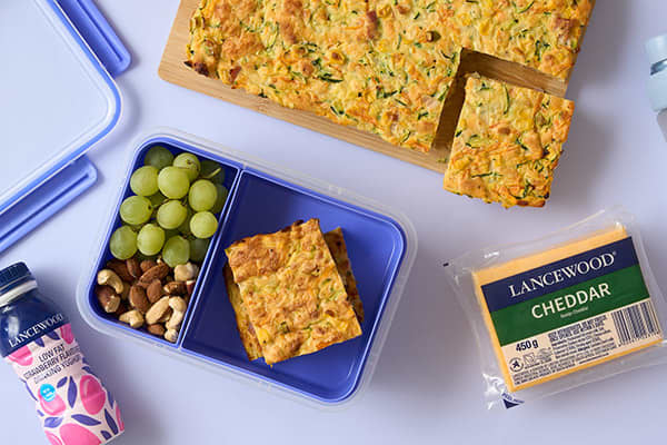 Golden baby marrow slice made with grated cheddar cheese, vegetables ...