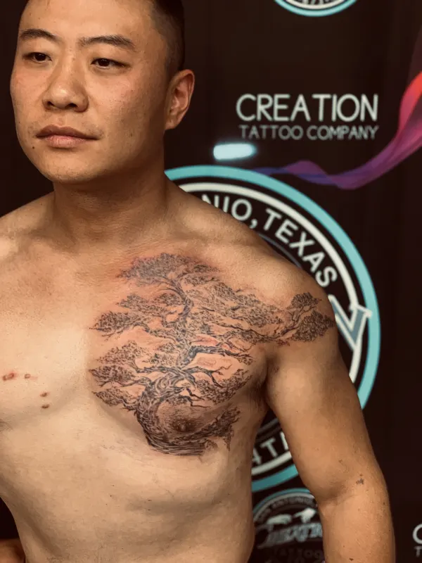 creation tattoo piercing