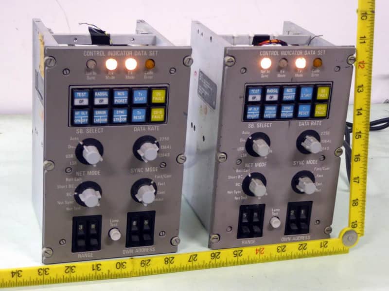 Practical grey aircraft control panels with coloured buttons, switches ...