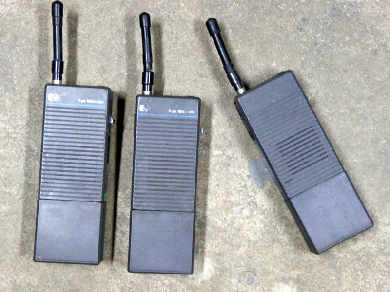 Pye PFX 1980s walkie talkies & charger station | Electro Props Hire