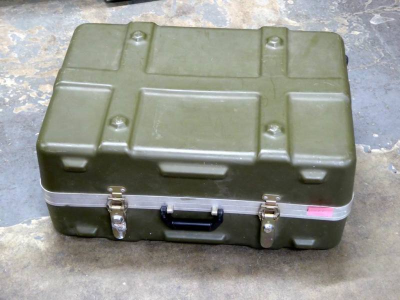 Ruggedised, ribbed khaki plastic flight case with corner wheels ...