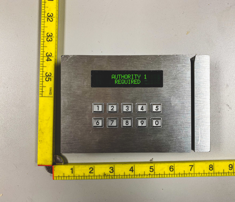 Practical modern looking card swipe entry panel with keypad and green ...