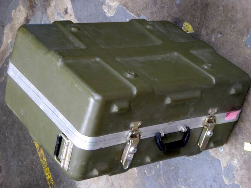 Ruggedised, ribbed khaki plastic flight case with corner wheels ...